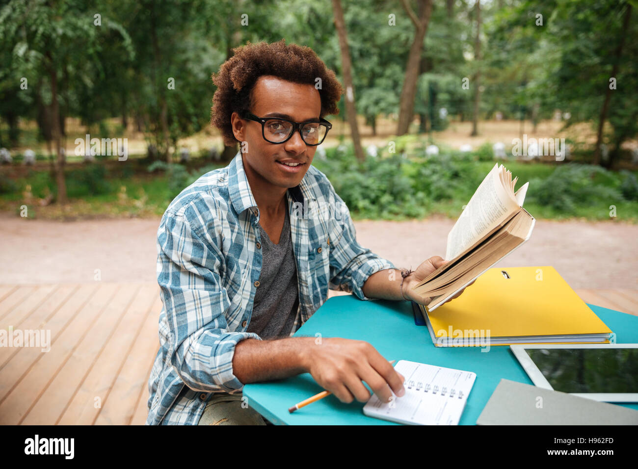 Happy attractive african young man studying outdoors Stock Photo - Alamy Happy attractive african young man studying outdoors Stock Photo - Alamy