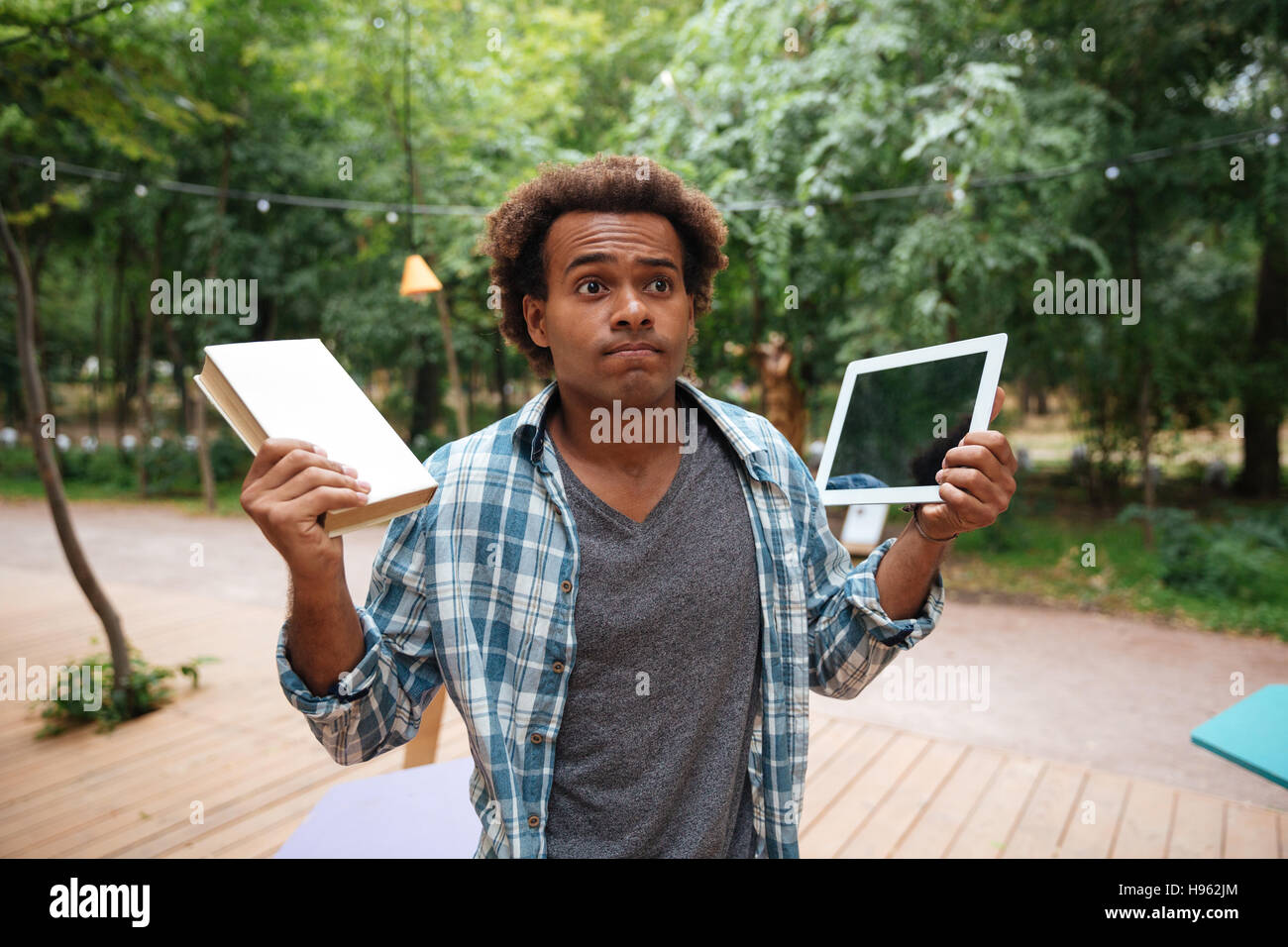Young man confused book hi-res stock photography and images - Alamy