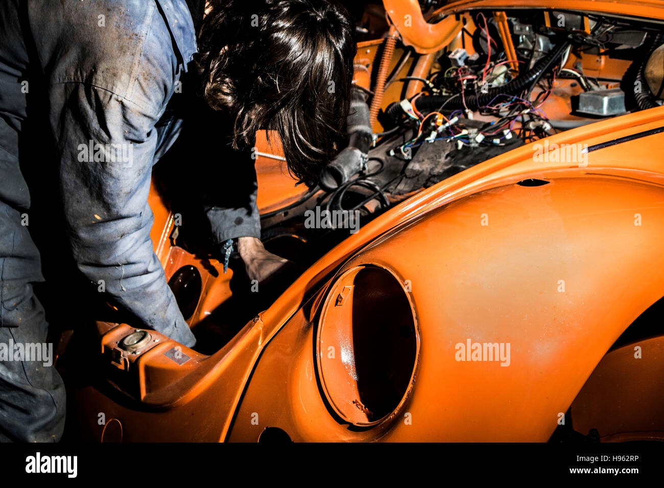 A young mechanic fixing a car engine Stock Photo - Alamy