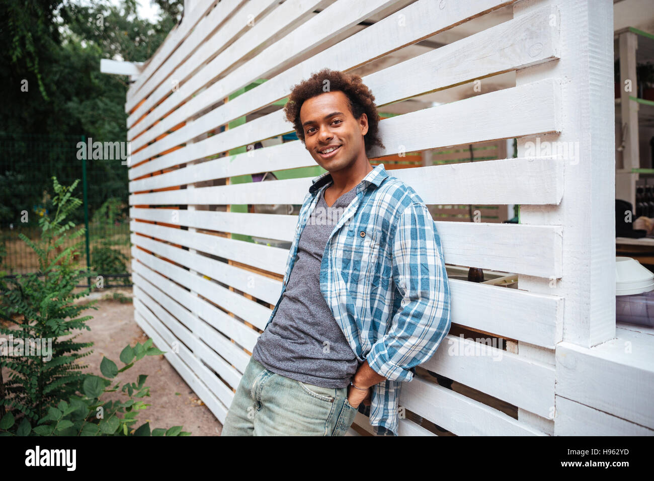 Portrait of happy handsome african young man standing outdoors Stock ...