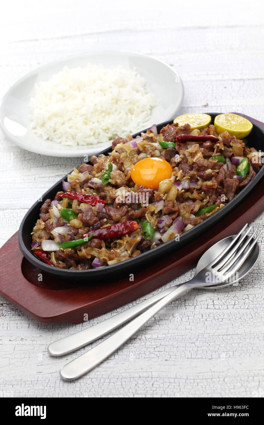 sizzling pork sisig, filipino cuisine Stock Photo - Alamy