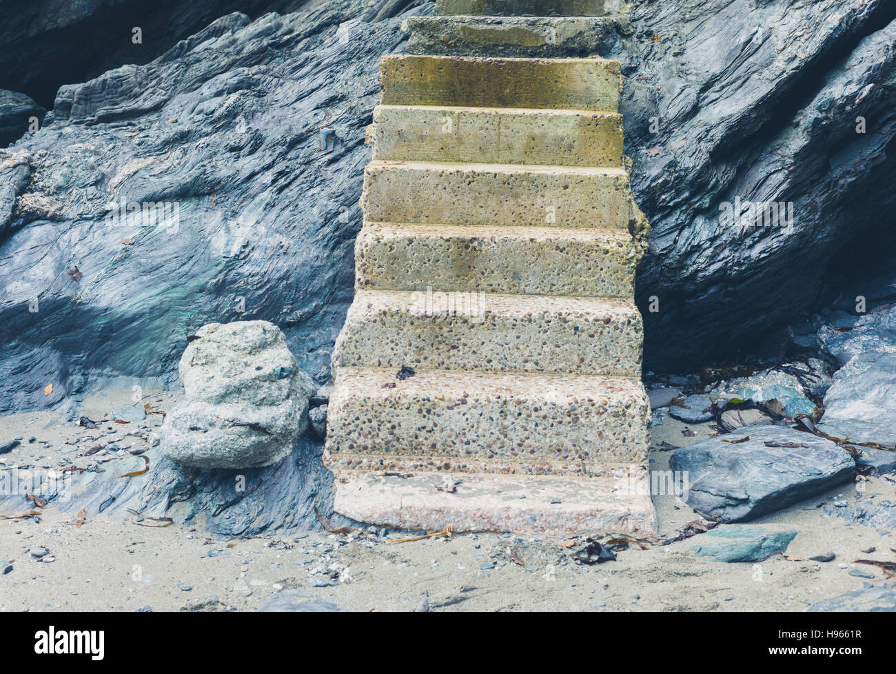 Some concrete steps leading up a cliff on the coast Stock Photo - Alamy
