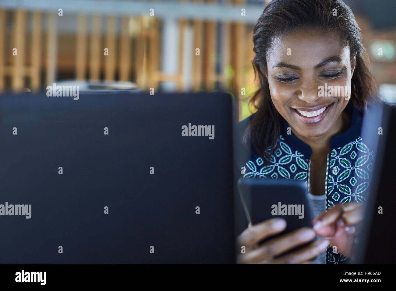 Smiling while texting hi-res stock photography and images - Alamy