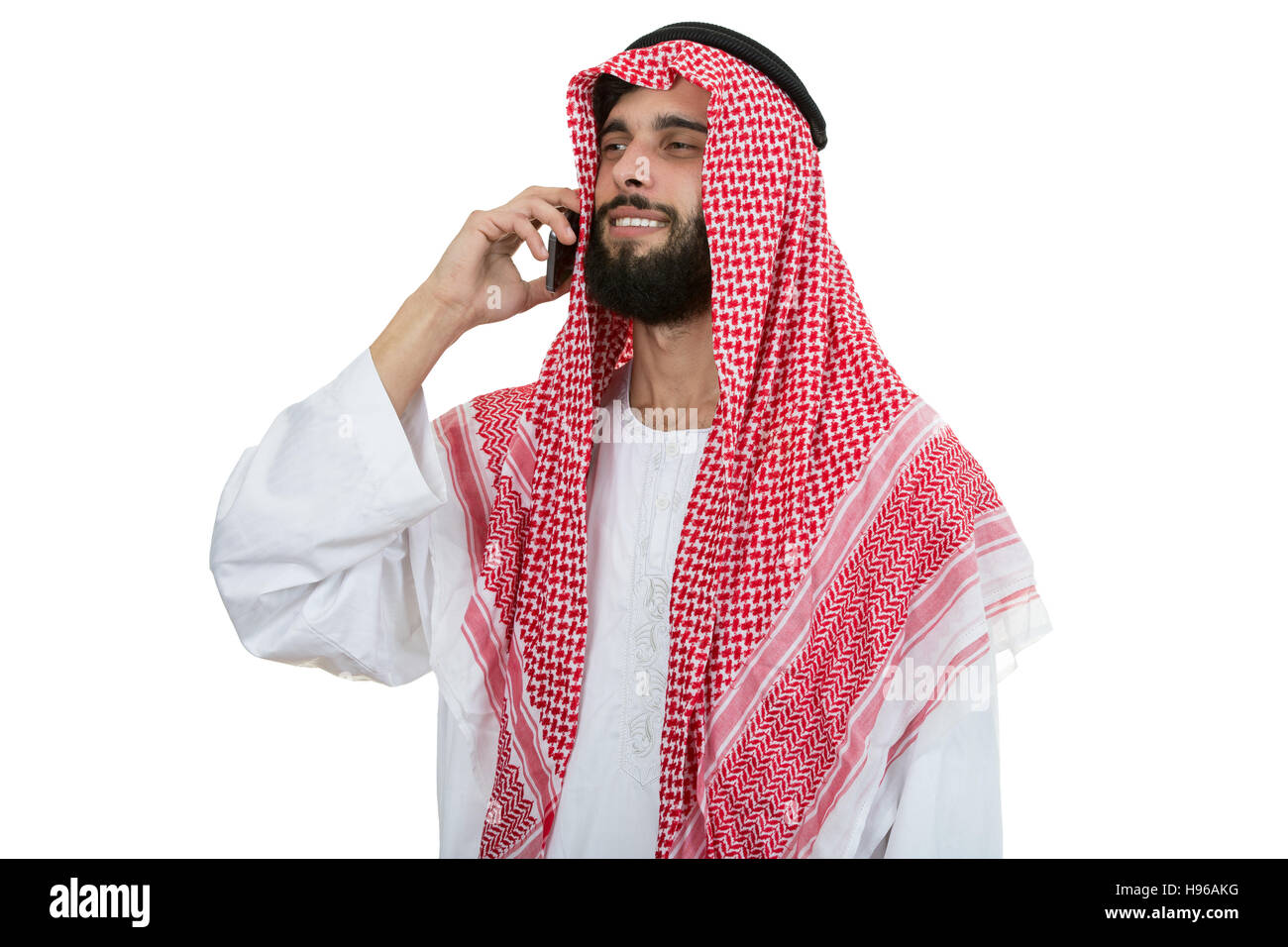 Side view of an arab saudi emirates man using a smart phone Stock Photo ...