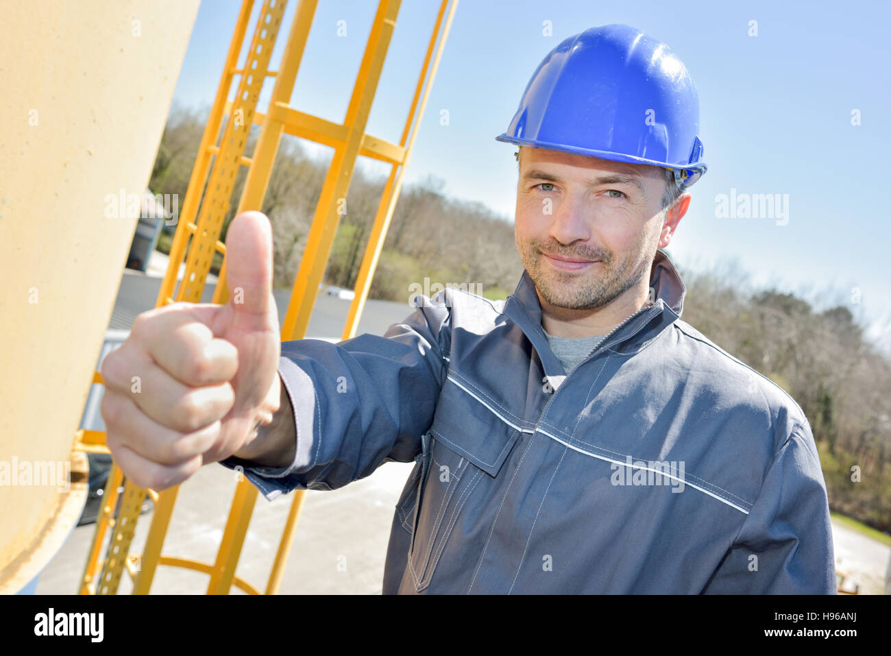 engineer with thumb up sign outdoors Stock Photo - Alamy
