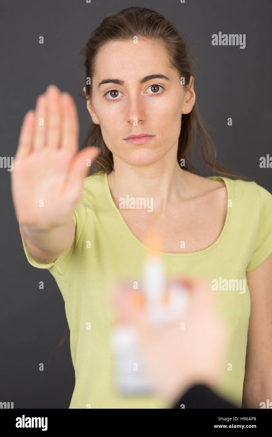 female hand stop sign on grey background Stock Photo - Alamy
