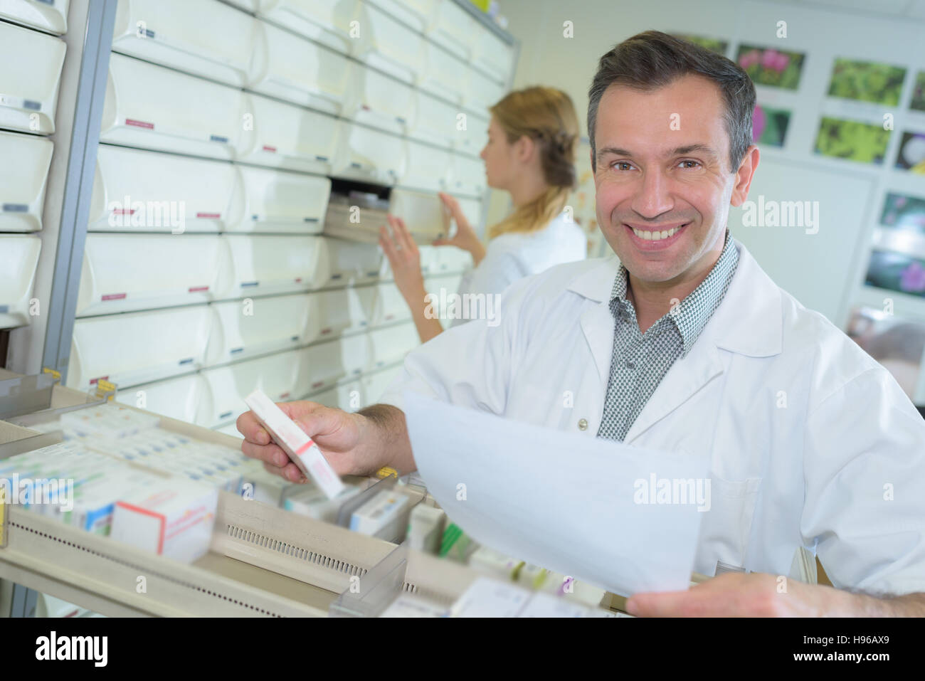 pharmacist presenting ranging medication Stock Photo - Alamy