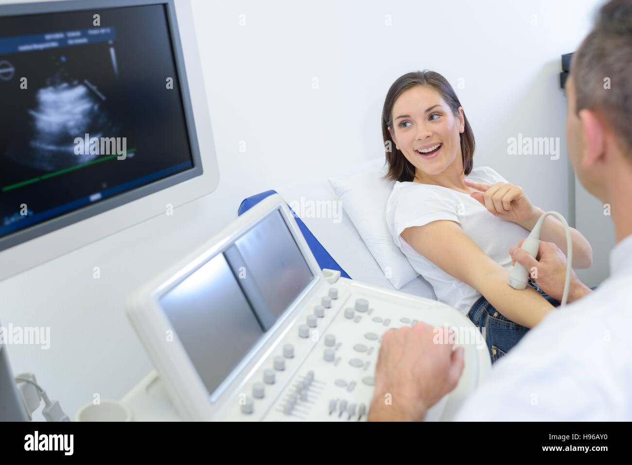 pregnant woman checking her echography Stock Photo - Alamy