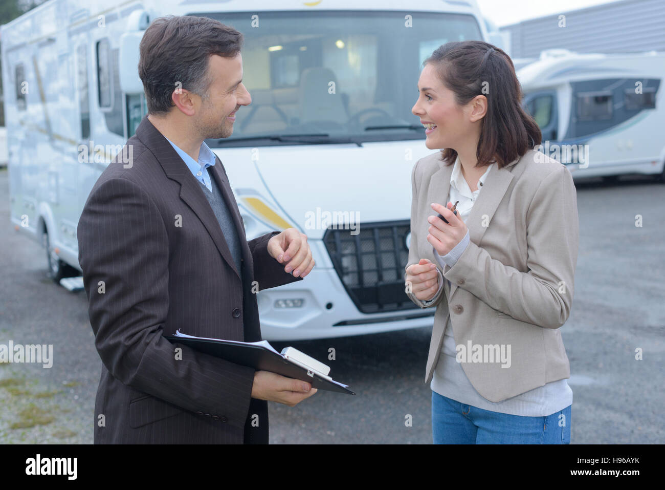 female driver holding happy to get driving results Stock Photo - Alamy