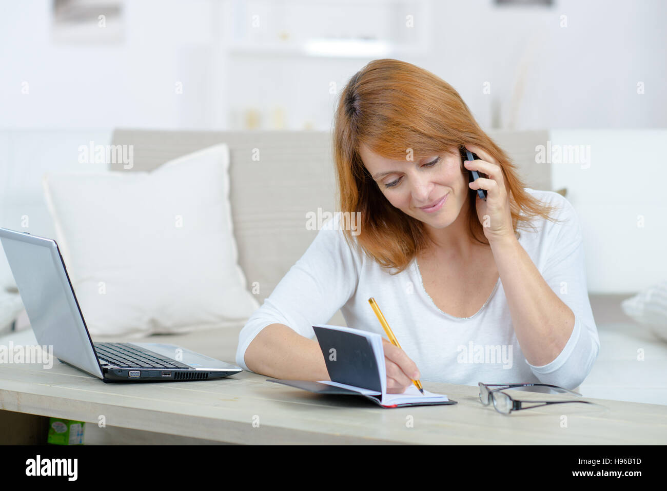 woman on the phone asking for an appointment Stock Photo - Alamy