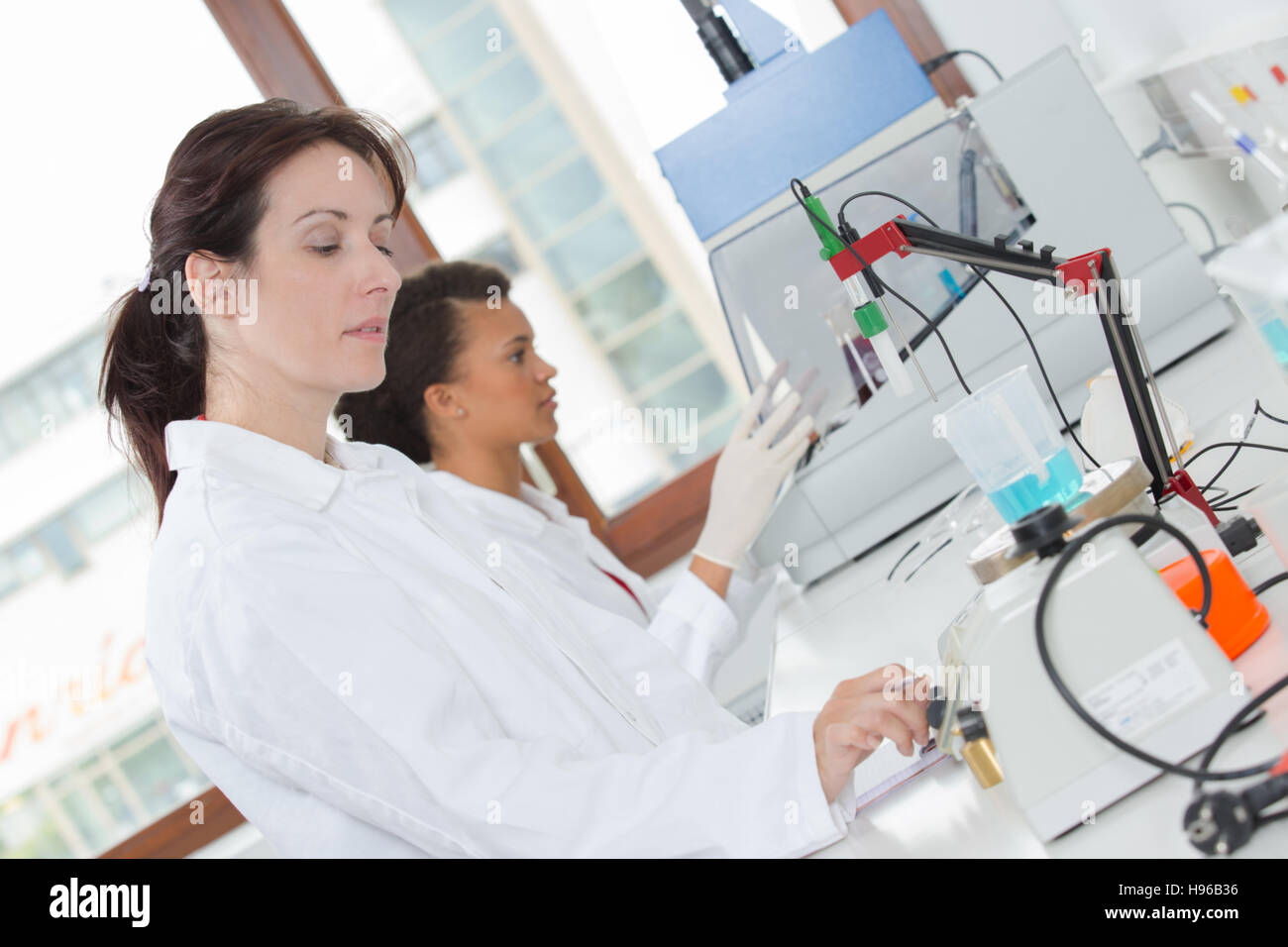 scientist woman in lab coat Stock Photo - Alamy