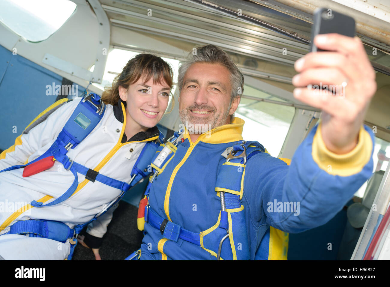 smiling people ready to jump from an airplane Stock Photo - Alamy