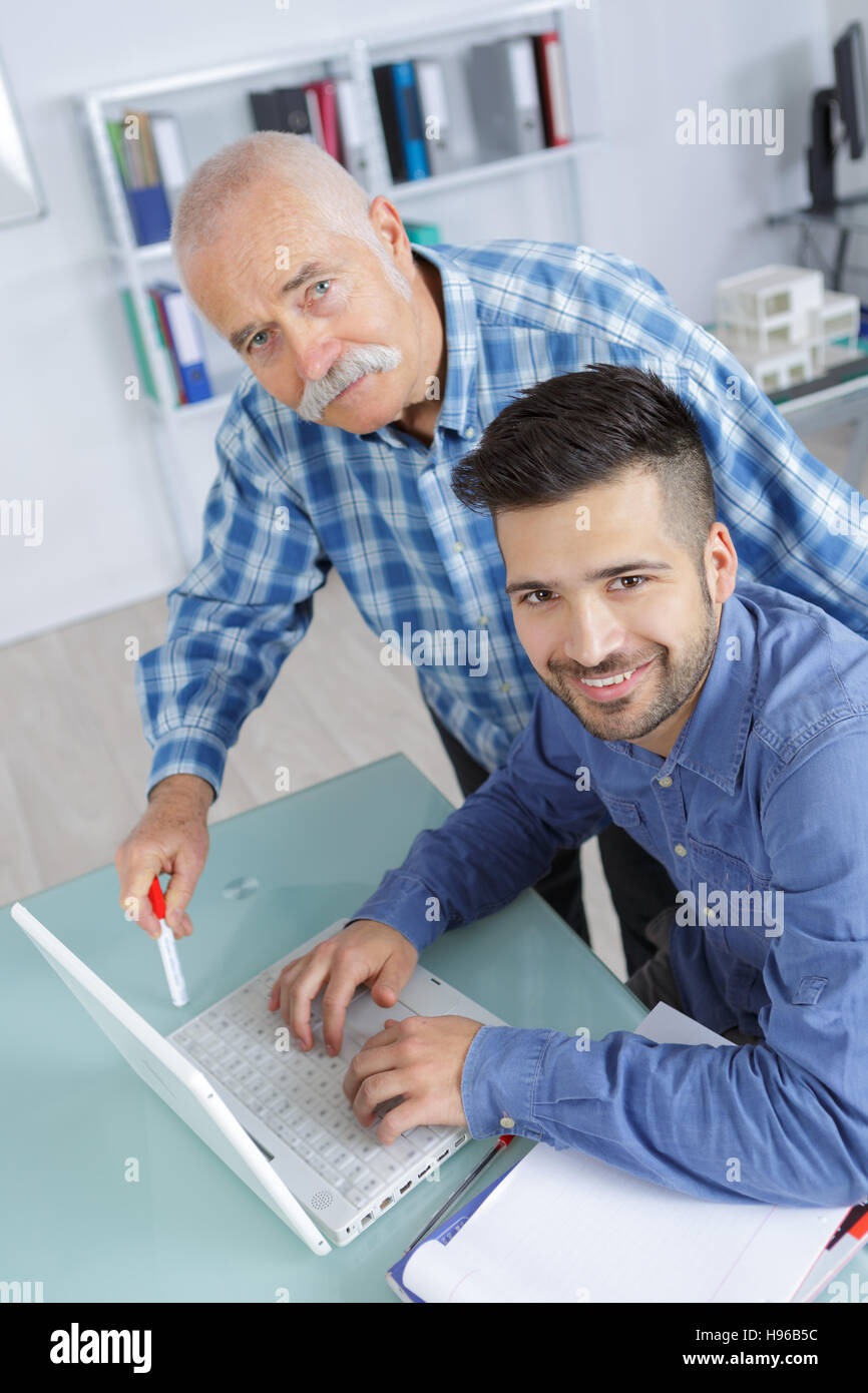 happy business partners or co-worker behind a desktop computer Stock ...