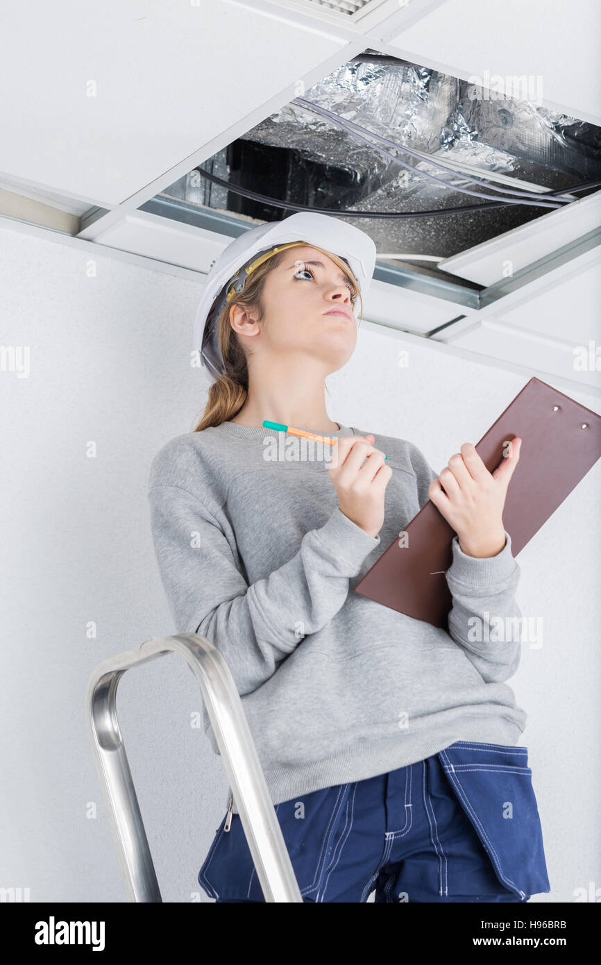 building inspector checking the ceiling Stock Photo - Alamy