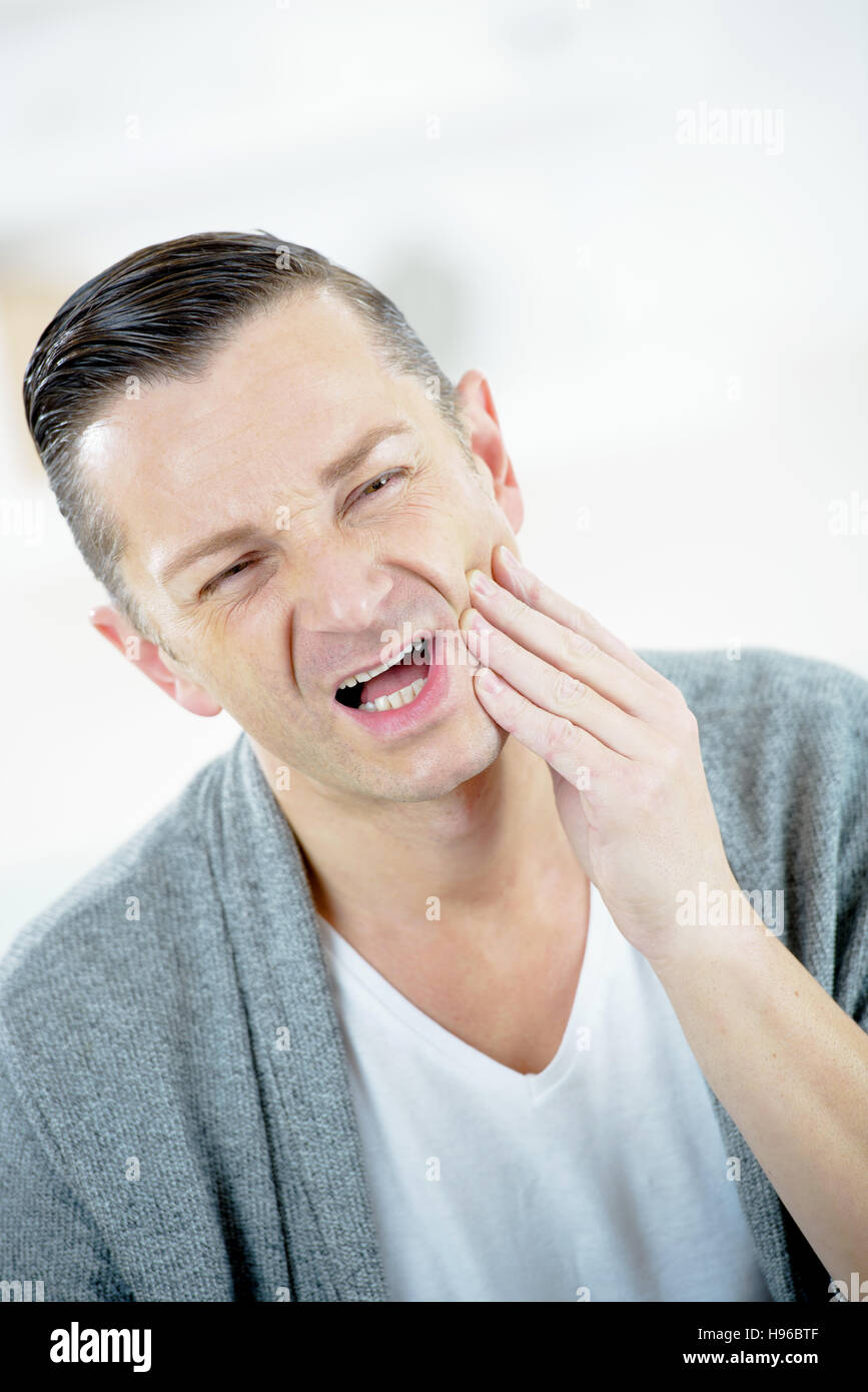 young man suffering from toothache Stock Photo - Alamy