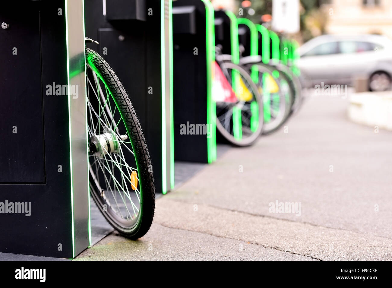Urban bicycle sharing system wheel detail Stock Photo - Alamy