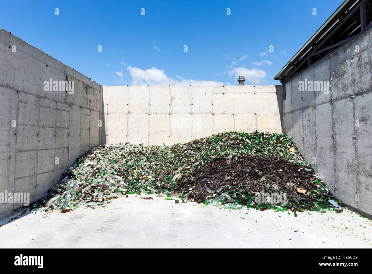 Glass waste for recycling in a recycling facility. Different glass ...