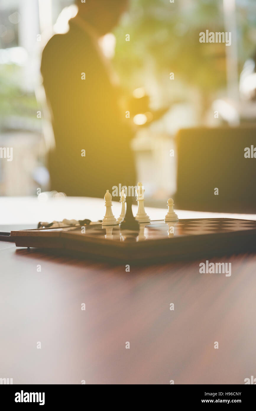 chess in office with background of businessman - business concept Stock ...