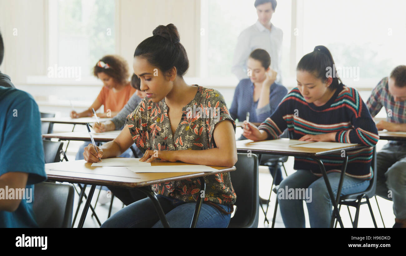 College students taking test desks hi-res stock photography and images ...