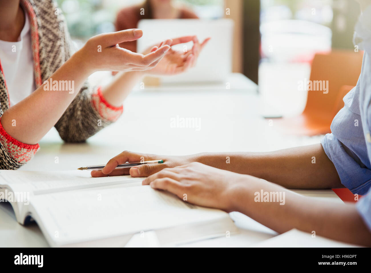 College students with textbook studying in library Stock Photo - Alamy