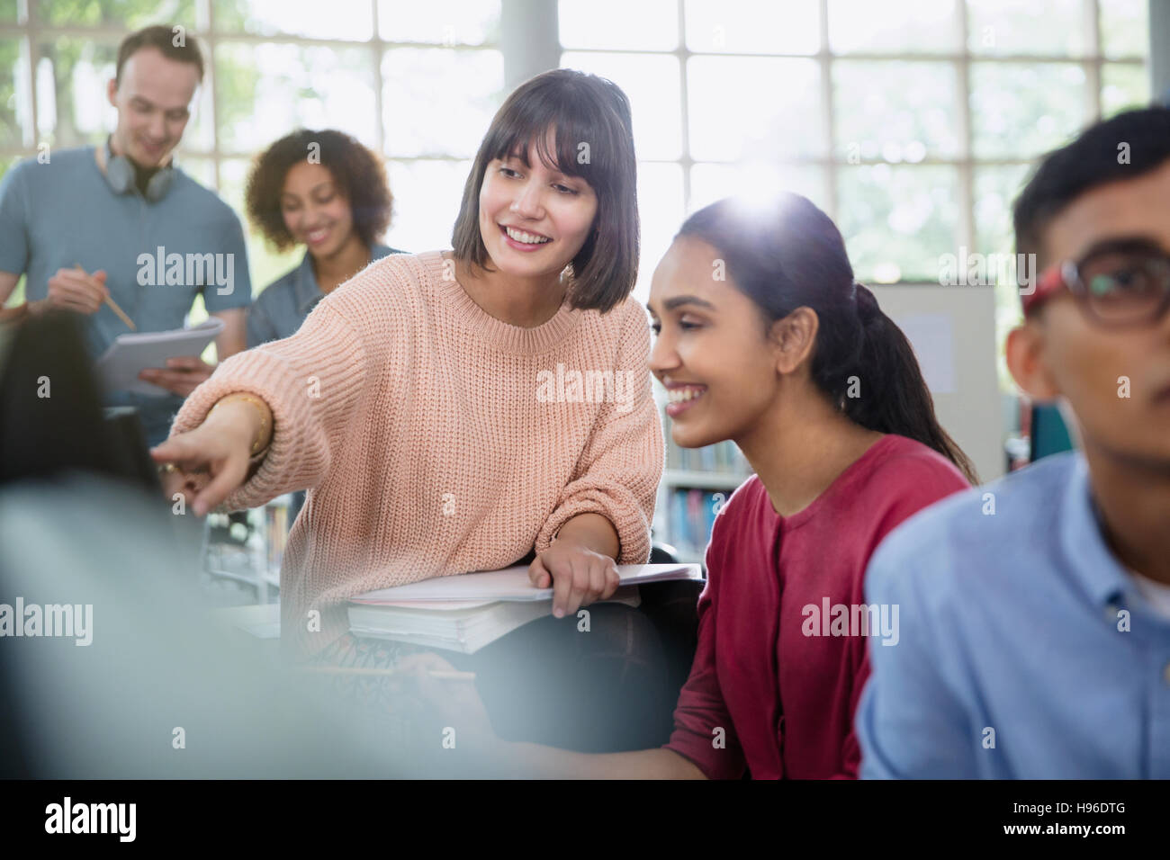 College students talking in classroom Stock Photo - Alamy