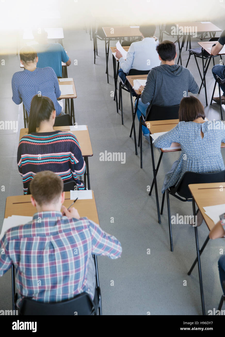 College students taking test at desks in classroom Stock Photo - Alamy