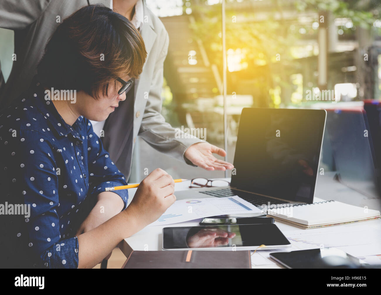 people working with document and laptop computer for use as office ...