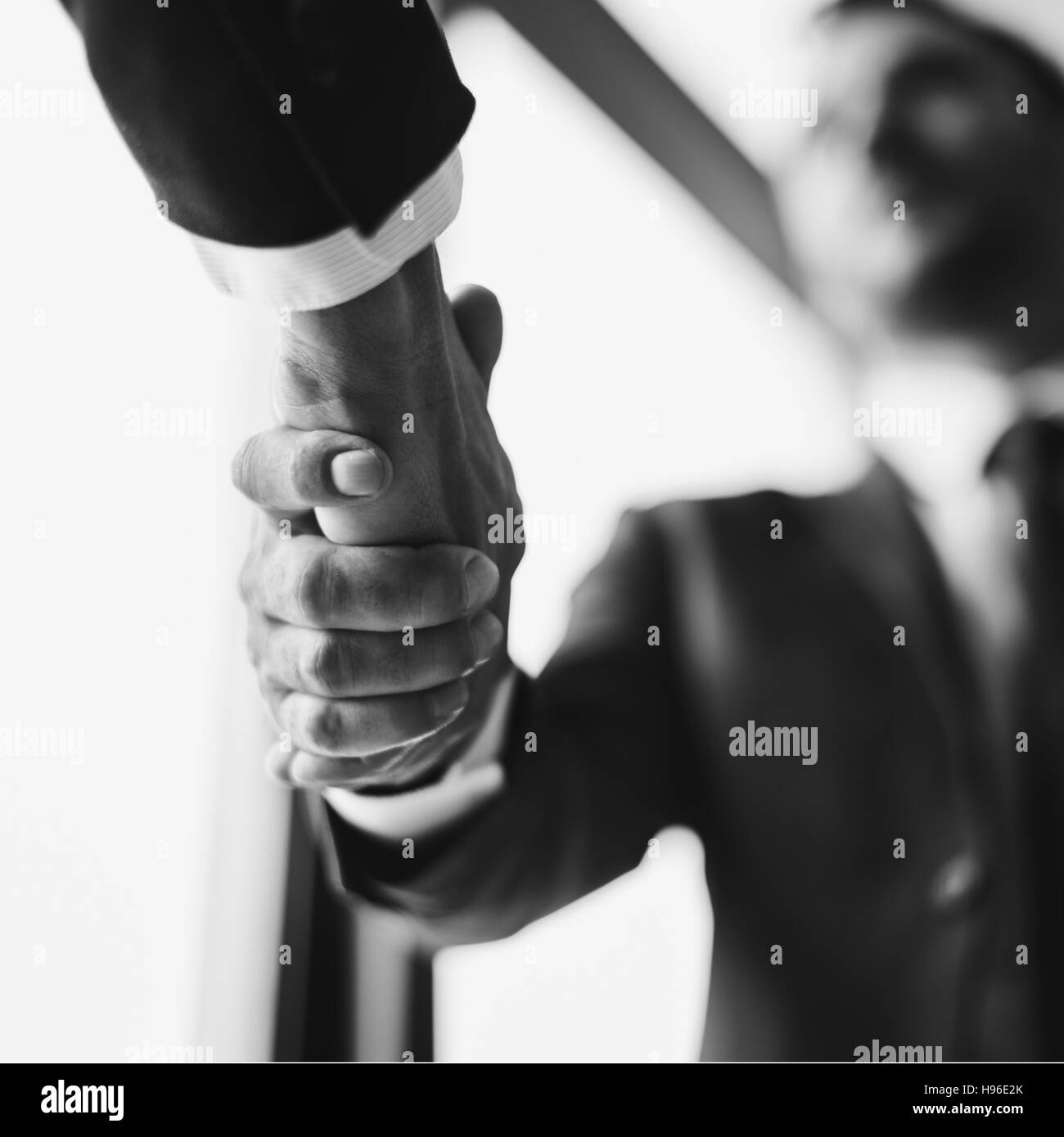 Partnership concept two businessman handshake Black and White Stock ...