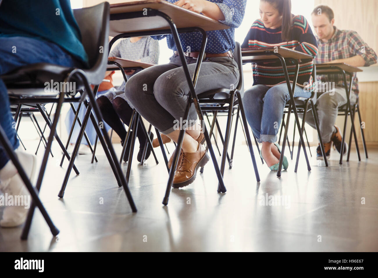 College students taking test at desks in classroom Stock Photo - Alamy