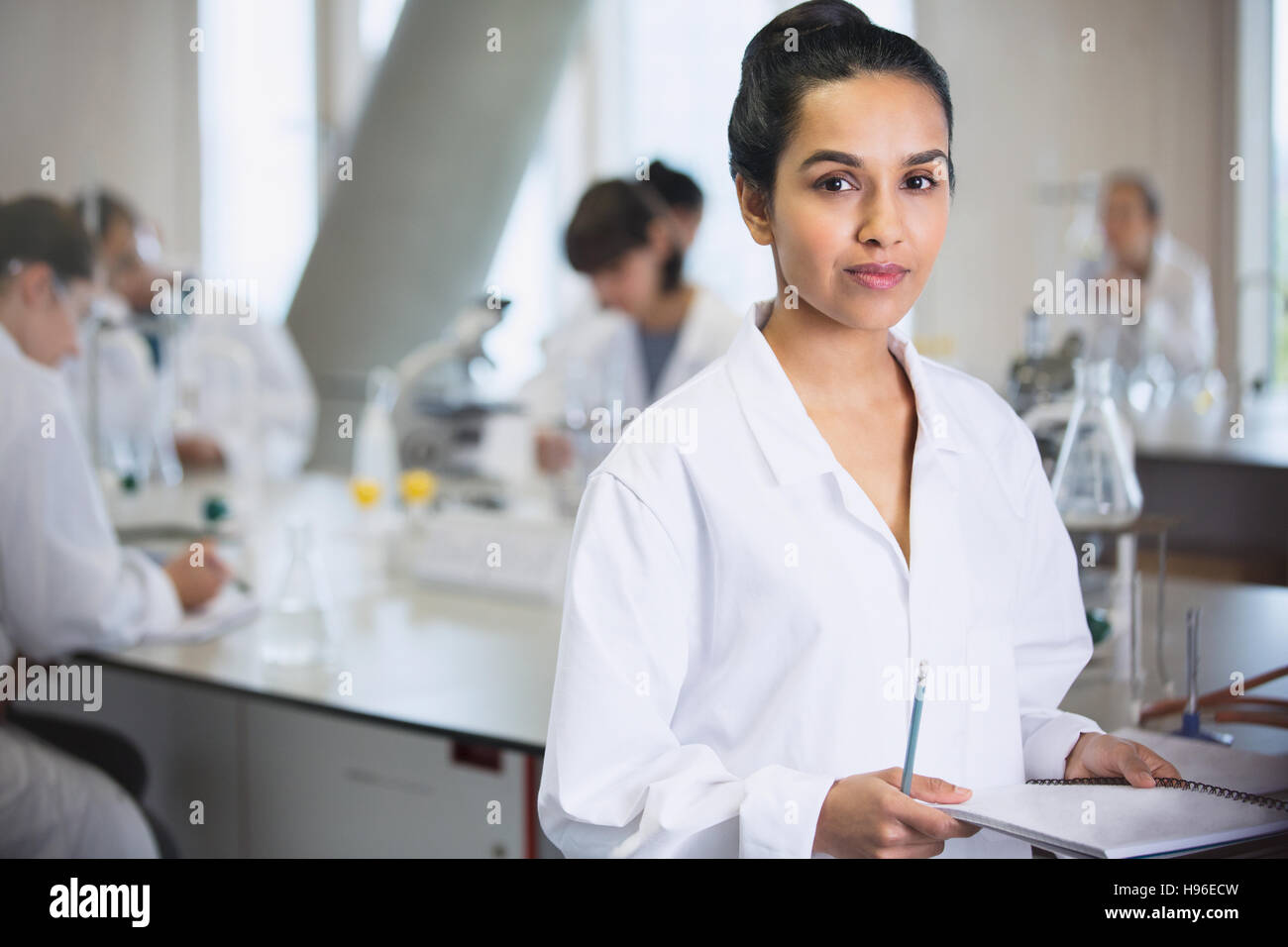 Portrait serious female college student in science laboratory classroom ...