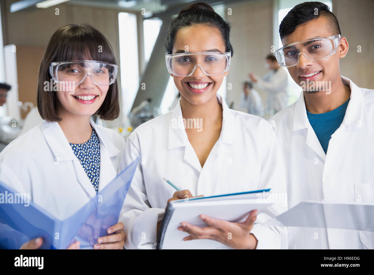 Portrait smiling college students in science lab coats Stock Photo - Alamy Portrait smiling college students in science lab coats Stock Photo - Alamy