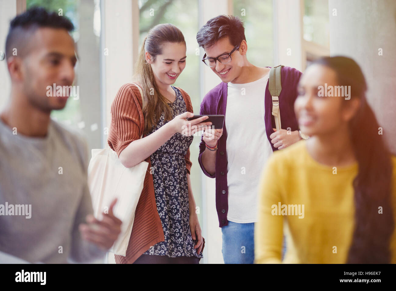 University students enjoying mobile phone hi-res stock photography and ...