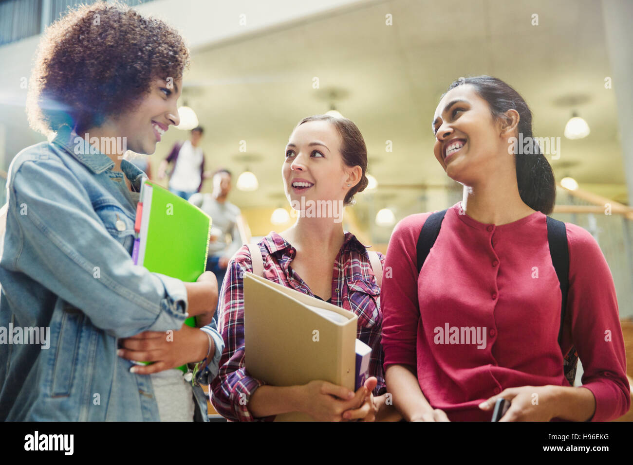 College students smiling and talking Stock Photo - Alamy