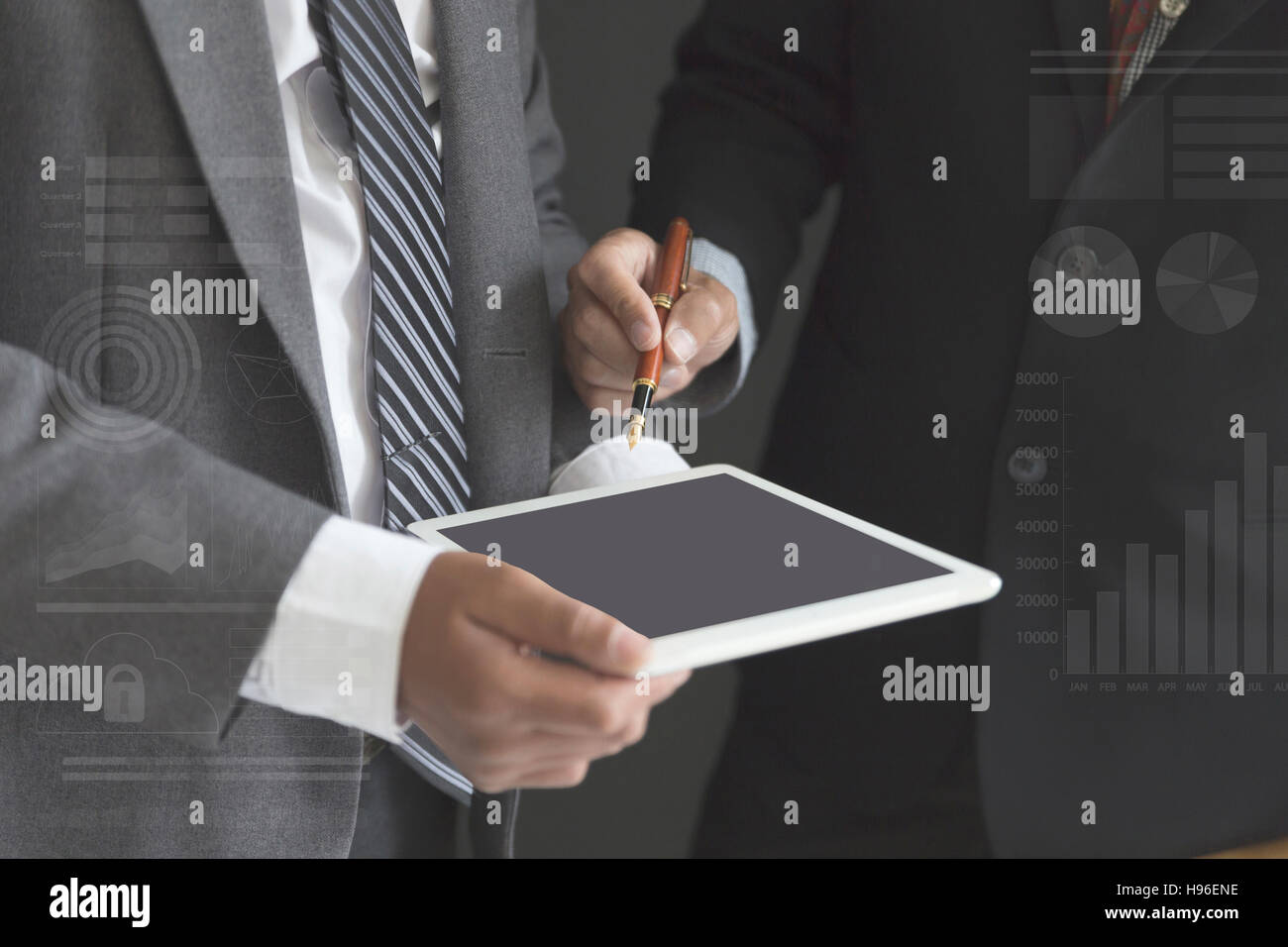 two businessmen in suit discuss and analyze business strategy with ...