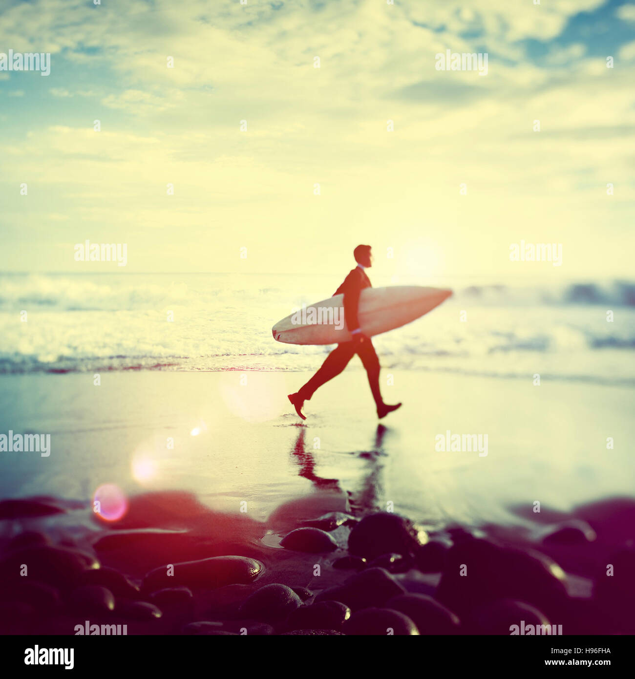 Lone Businessman by the Beach with Surfboard Stock Photo - Alamy