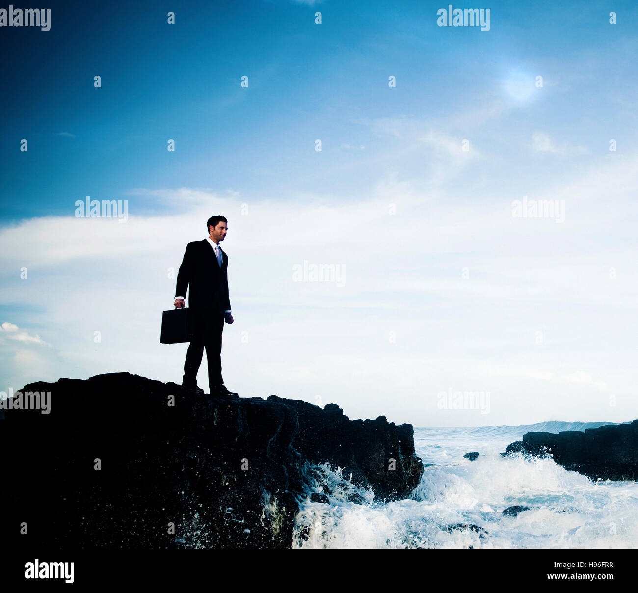 Businessman staying alone on island hi-res stock photography and images ...