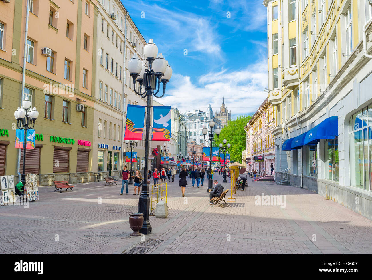 The tourist street of Arbat decorated with flags in honour of Victory ...