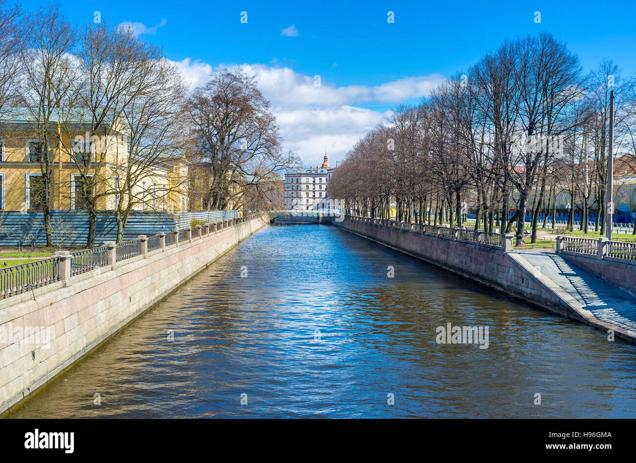 The stone banks of Griboedov Canal with the small park in Sadovaya ...