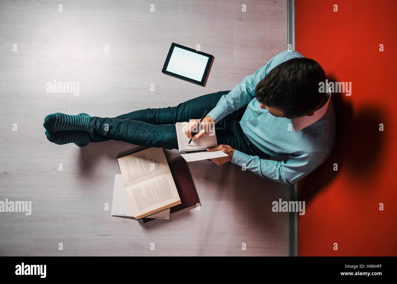 Persistent Young Student Studying on Floor Stock Photo - Alamy