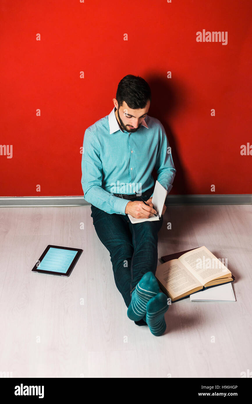 Persistent Young Student Studying on Floor Stock Photo - Alamy