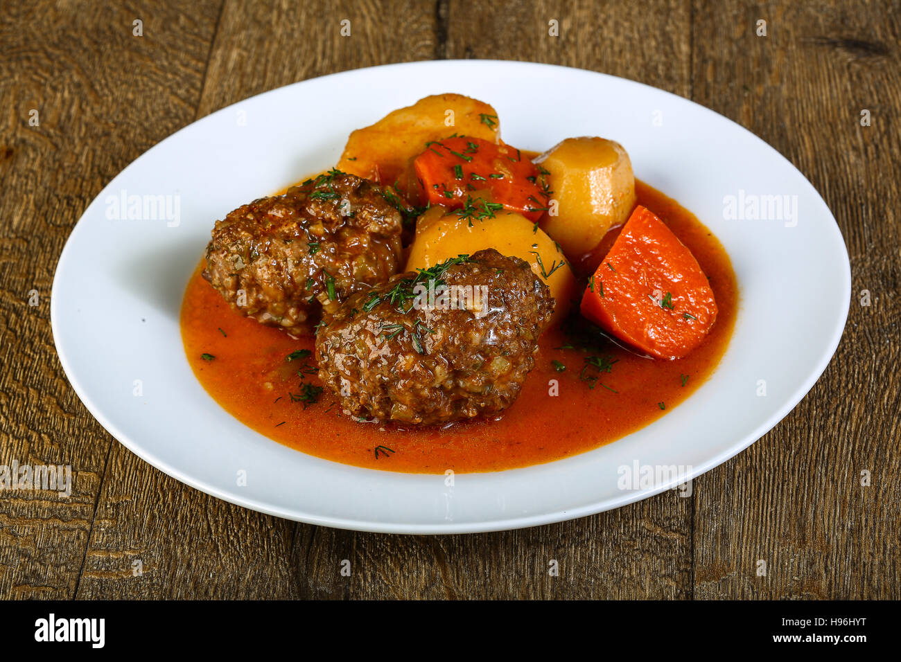 Minced meat balls with potato, carrots and sauce Stock Photo - Alamy