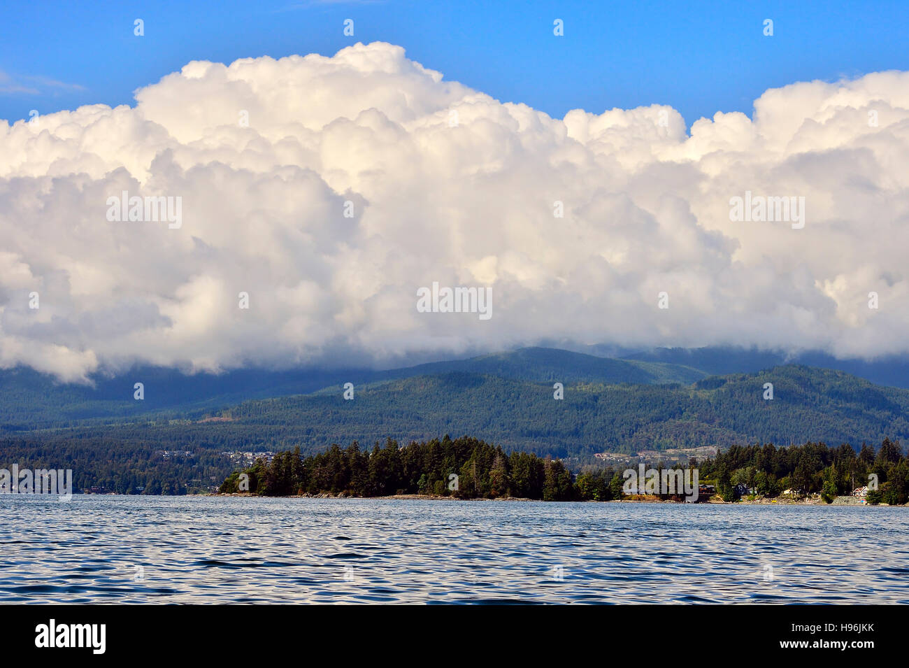 A white cloud formation hanging over Vancouver Island Stock Photo - Alamy