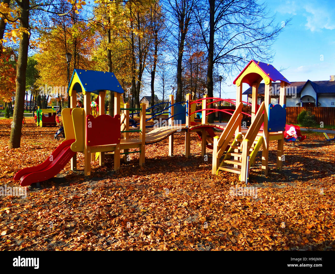 A bright picture of a playground in Autumn Stock Photo - Alamy