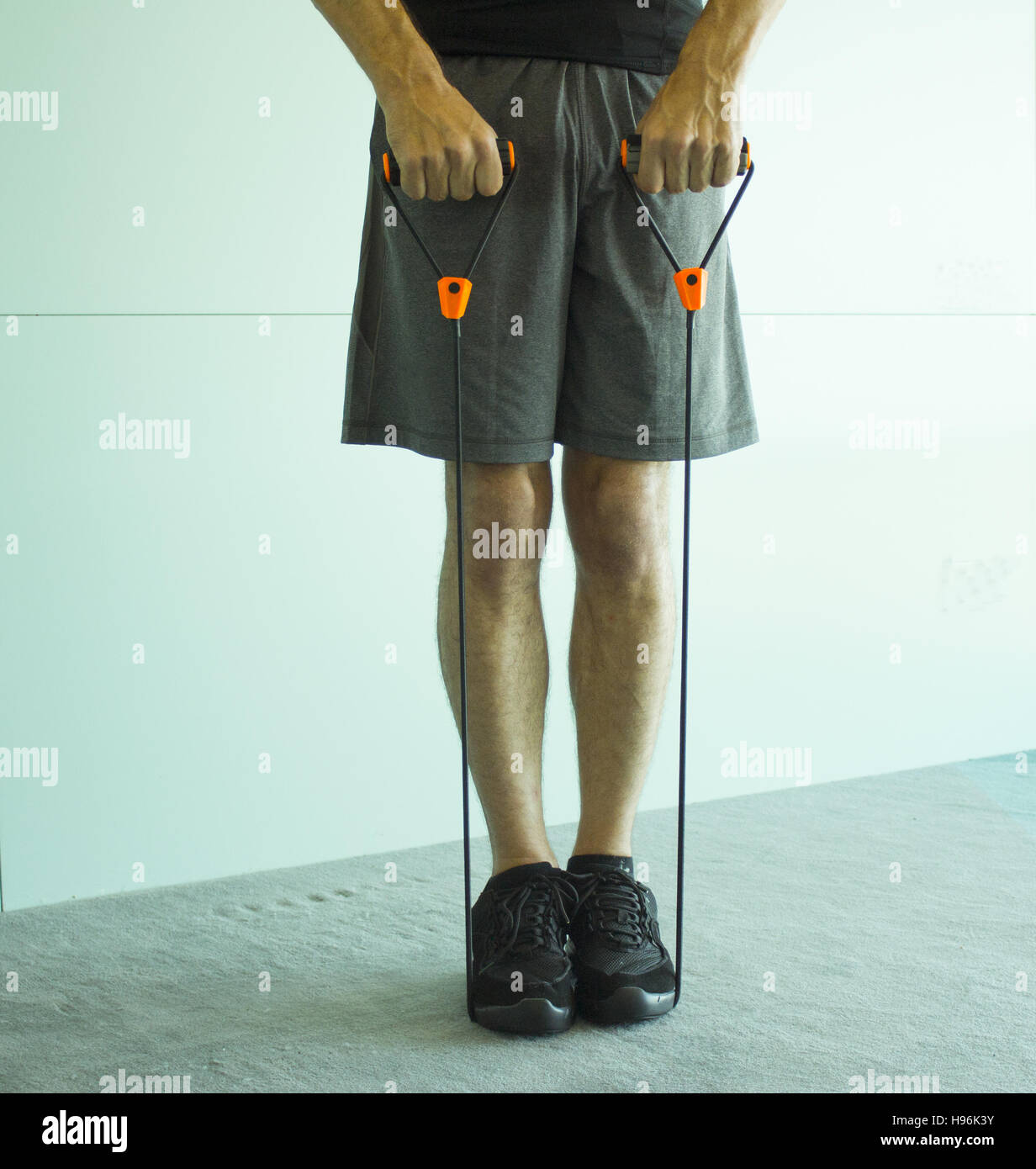 Performing exercises with resistance rope fitness Stock Photo - Alamy