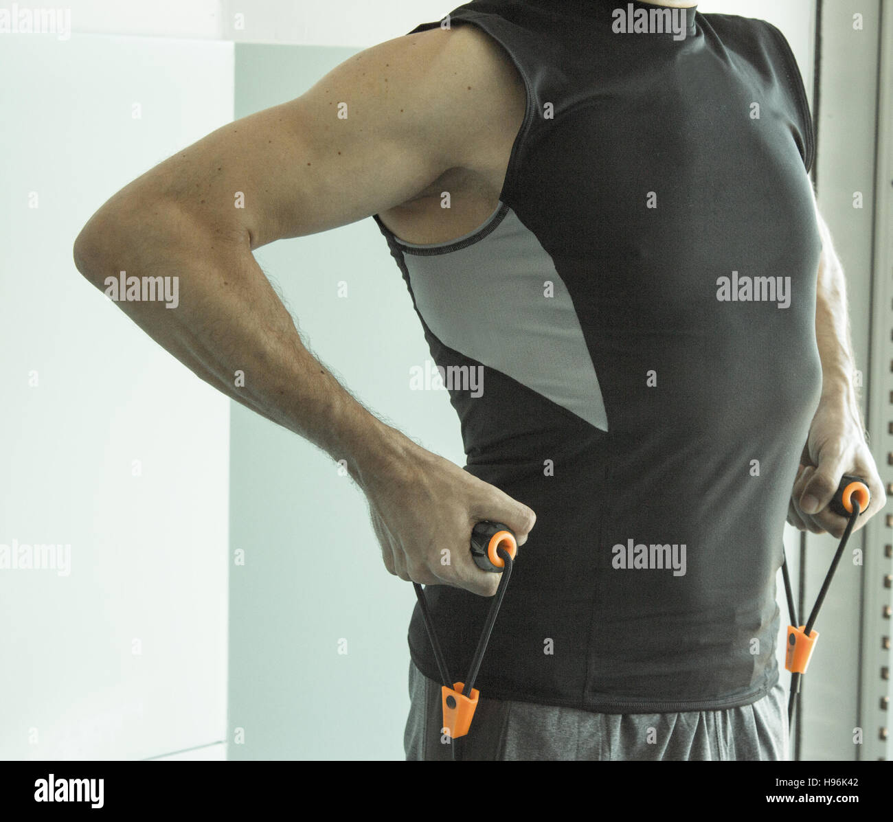 Performing exercises with resistance rope fitness Stock Photo - Alamy