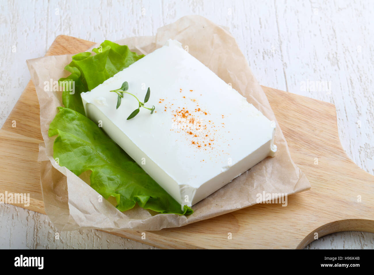 Greek traditional Feta cheese with thyme leaves Stock Photo - Alamy