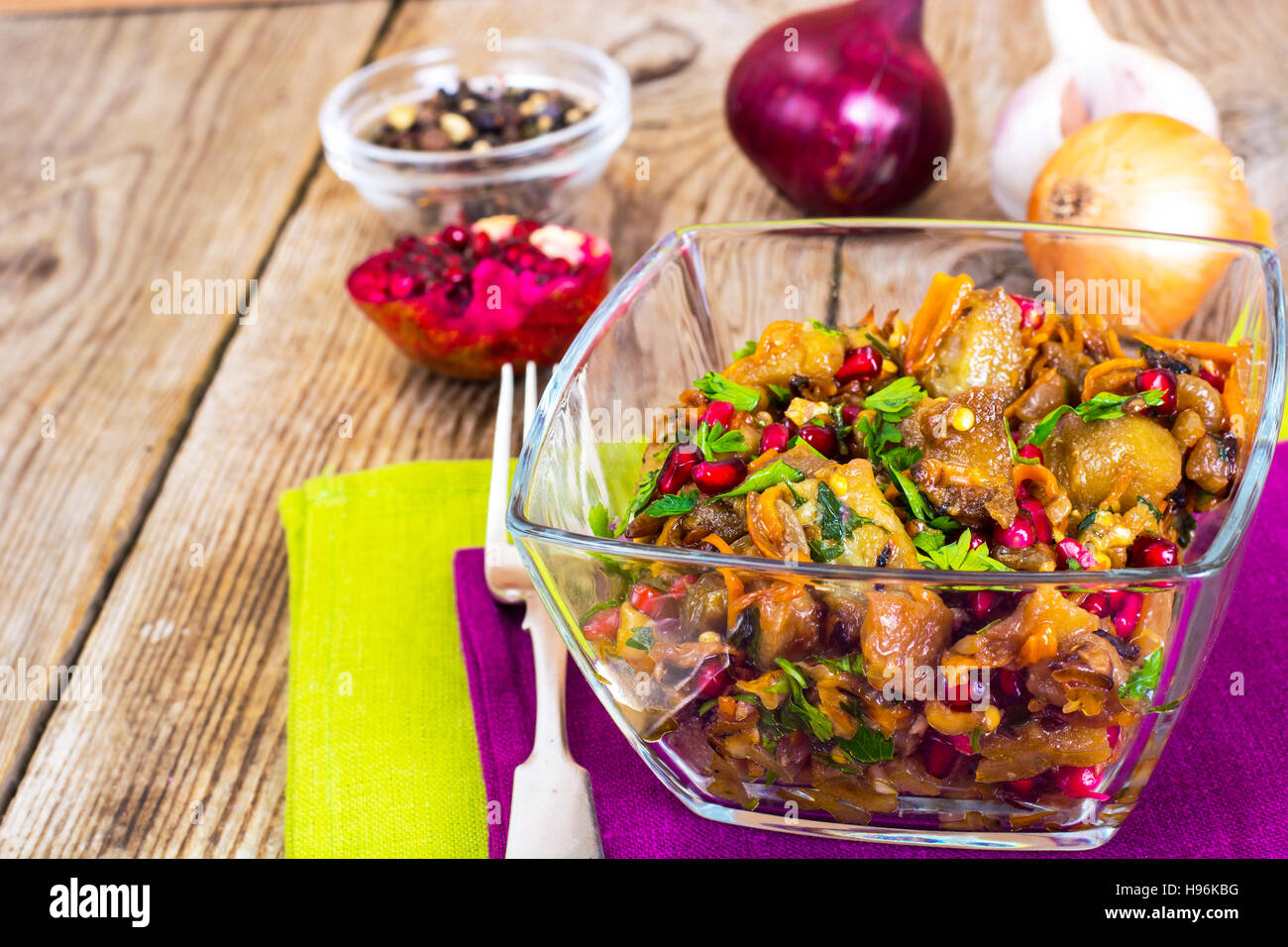 Food without meat. Steve eggplant with pomegranate seeds and herbs in a ...