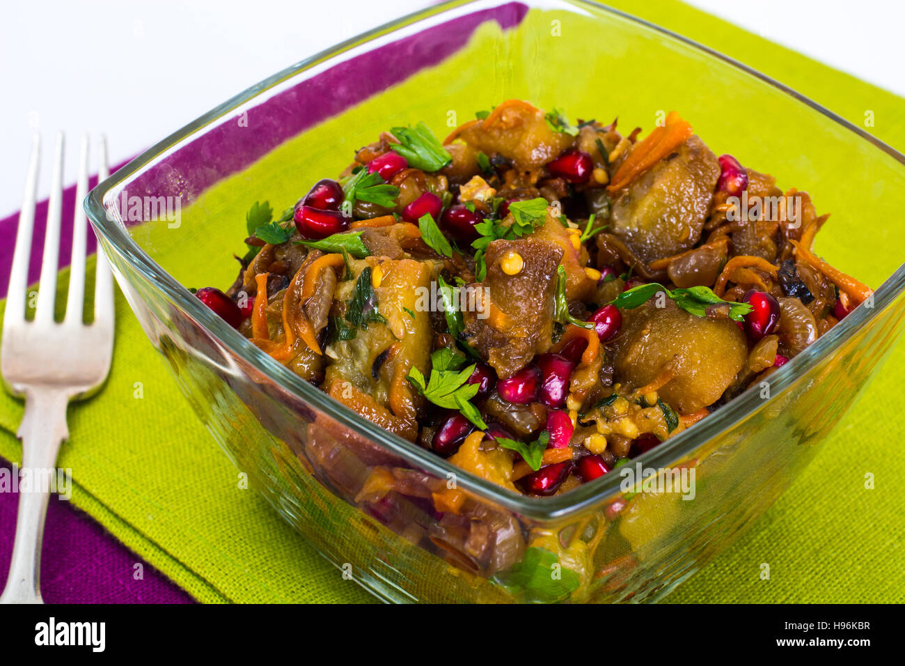 Food without meat. Steve eggplant with pomegranate seeds and herbs in a ...