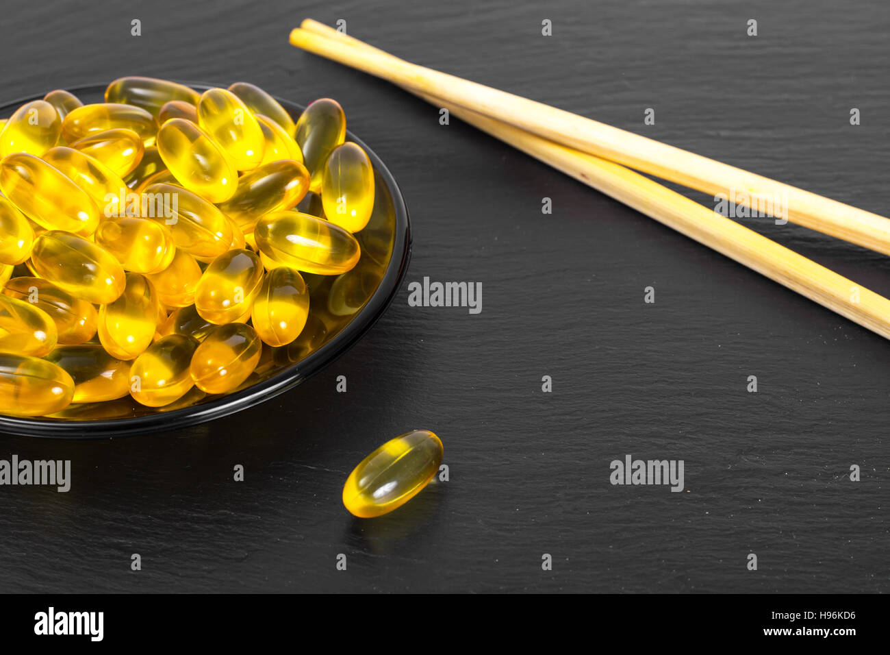 Fish oil supplements in soft gel capsule, healthy product concept ...