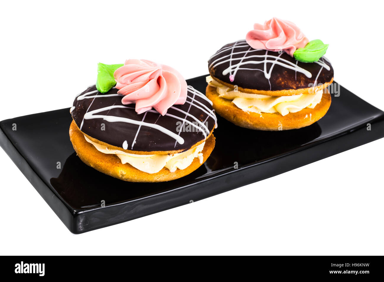 Colorful biscuits cakes bush with icing and custard filling. Studio ...